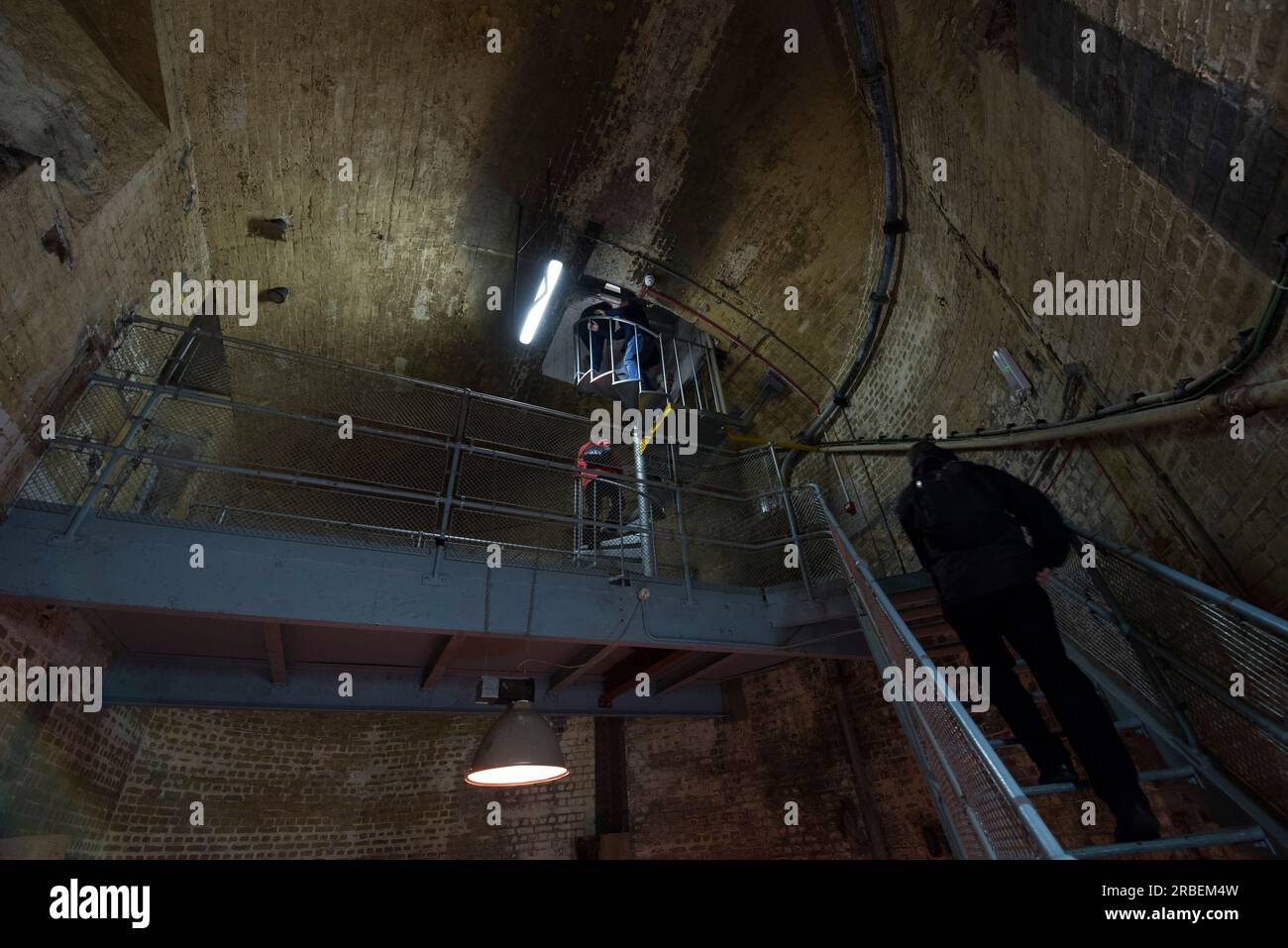 a spiral staircase leading down to the bascule chamber in Tower bridge ...