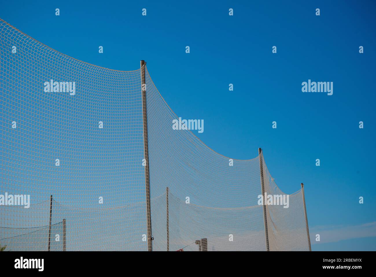 Beach protective net for beach volleyball court Stock Photo - Alamy