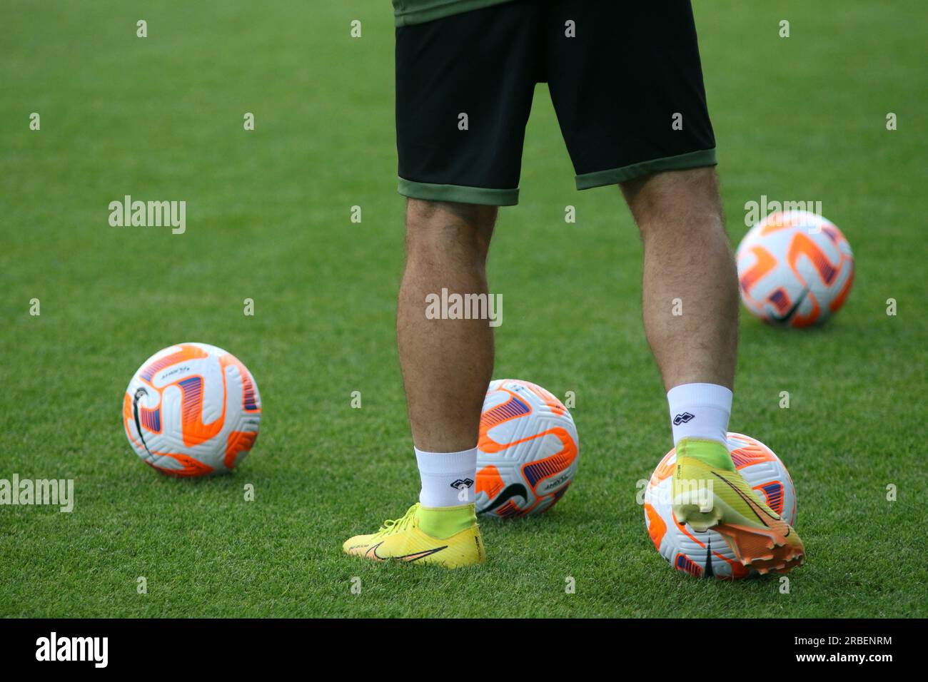 A football player's foot kick a soccer ball in the Pari Premier Cup ...