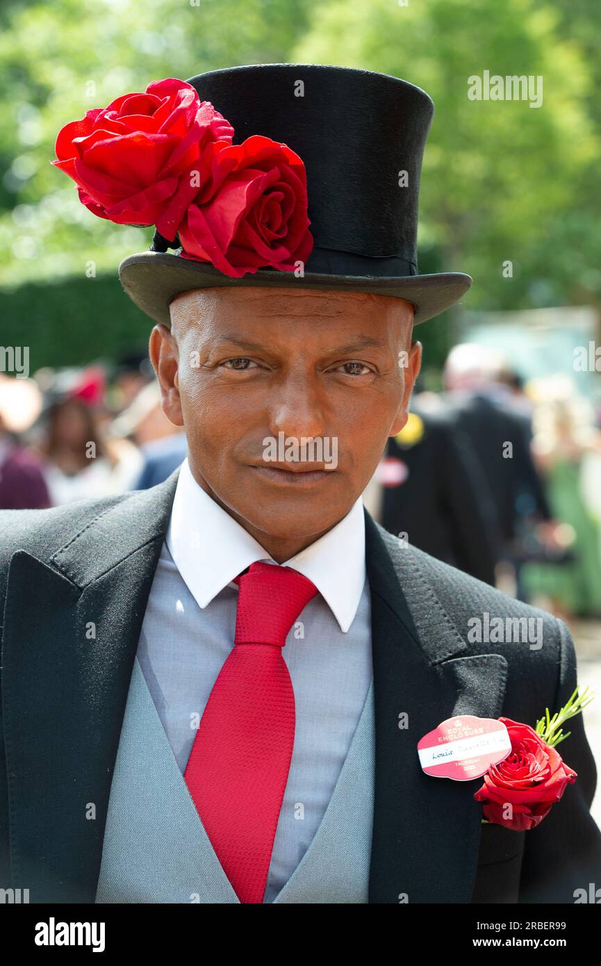 Ascot, Berkshire, UK. 22nd June, 2023. A man wears a top hat with red ...