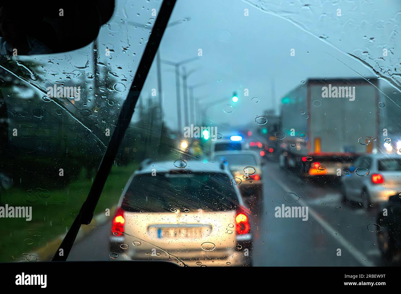 Traffic outside visible from inside the vehicle when it's raining Stock ...