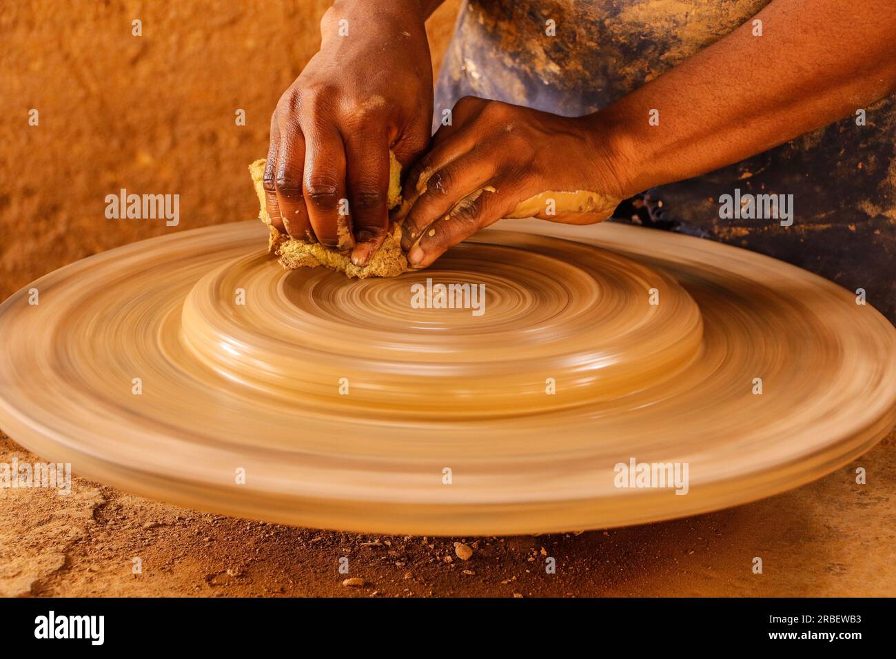 Nigeria craftswoman Olugbade Adekemi makes clay pots using traditional ...