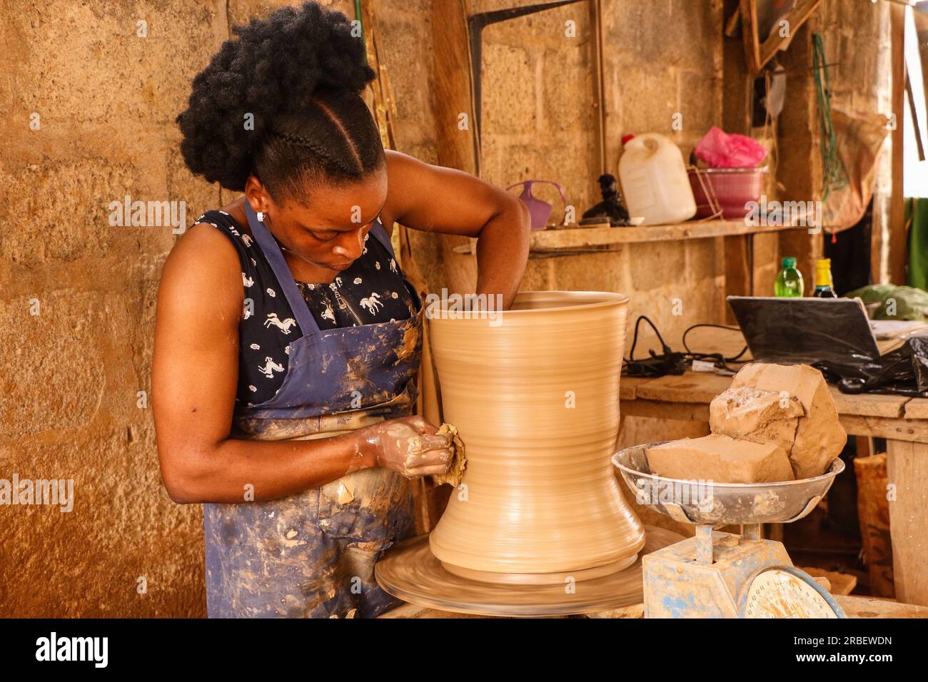Nigeria craftswoman Olugbade Adekemi makes clay pots using traditional ...