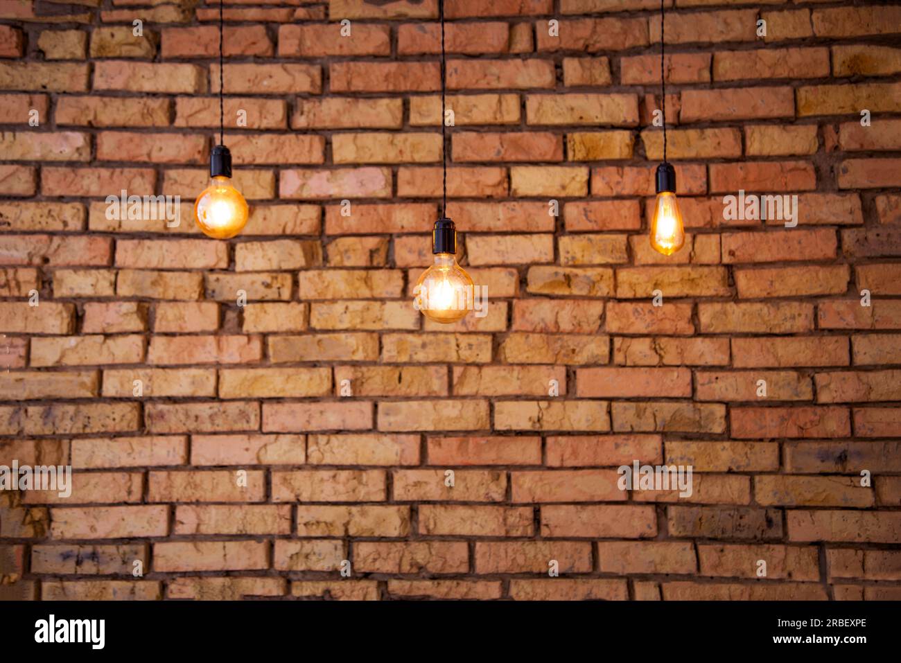 Old electric incandescent lamps with tungsten filament. Against the ...