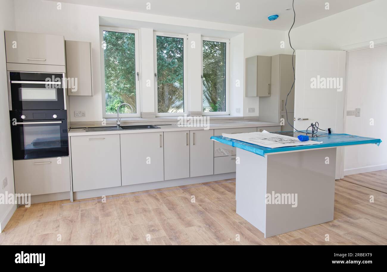 New kitchen installation with induction hob on cabinet island Stock ...