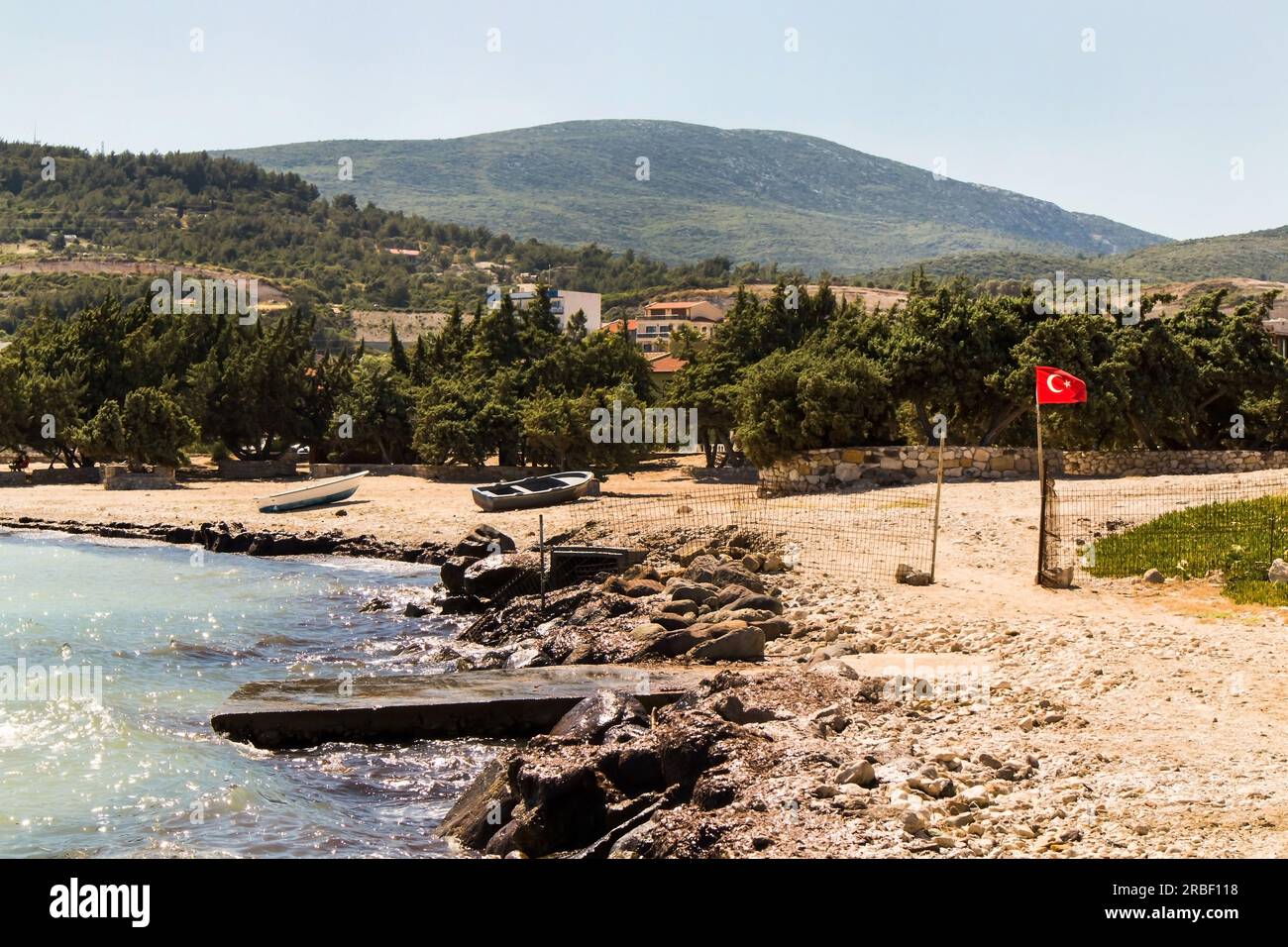 Quiet beach in Izmir, Turkey with juniper trees, Turkish Flag and ...