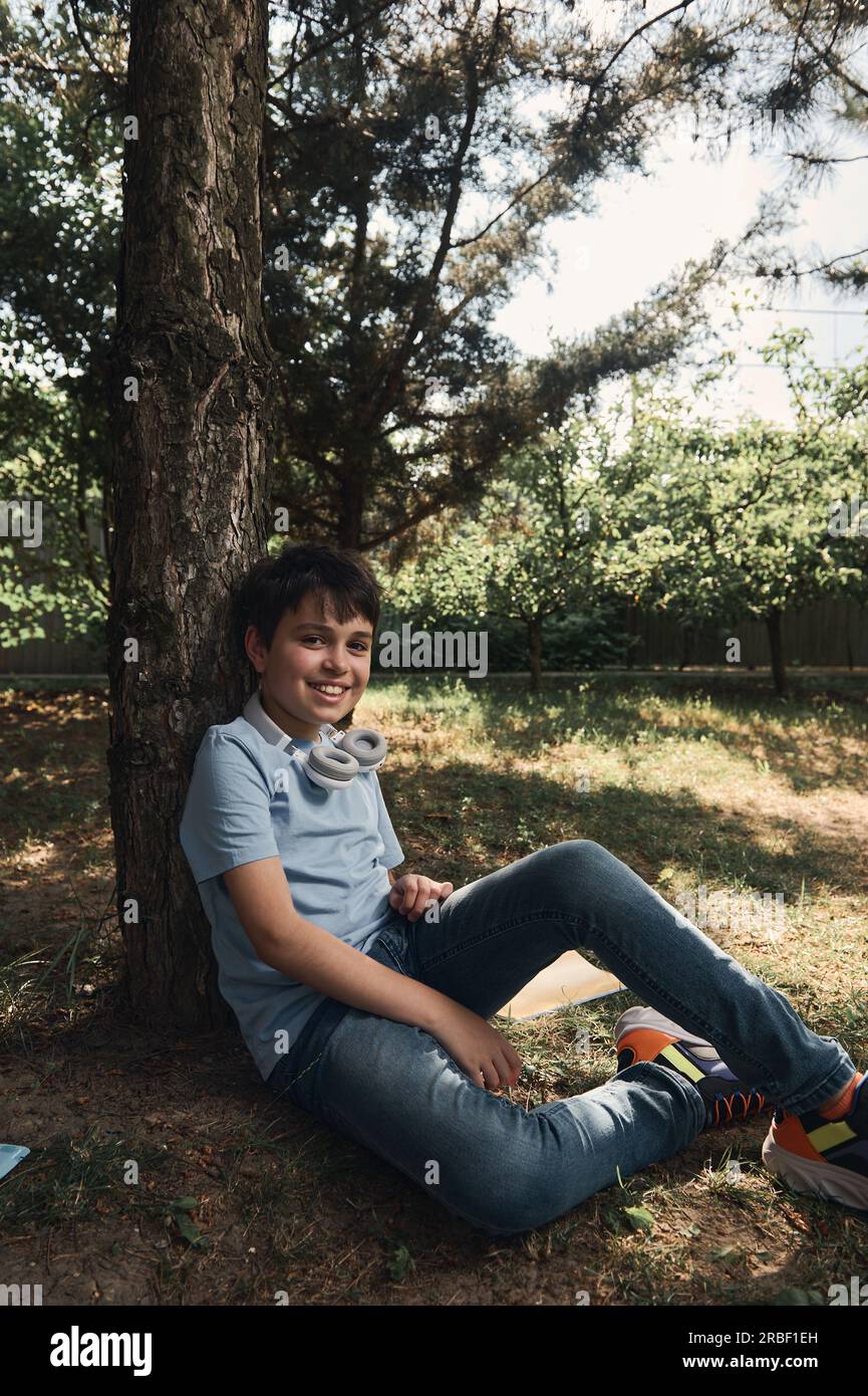 Toned full length portrait of multi-ethnic cheerful teenager, handsome ...