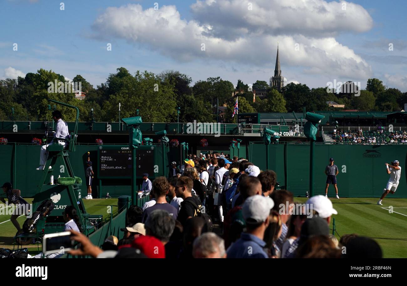 A general view as crowds watch the outside court action on day seven of ...