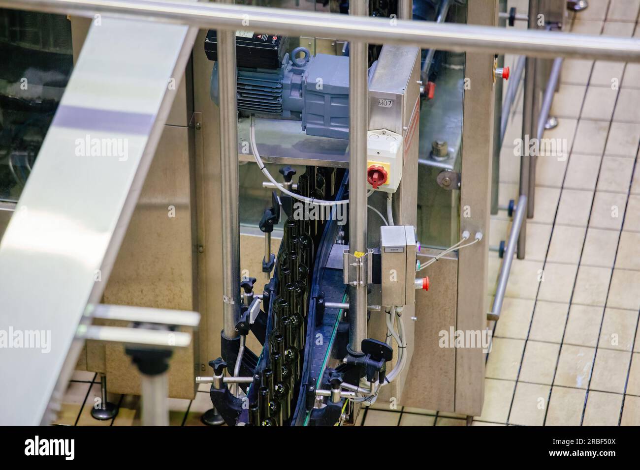 Bottling and sealing wine conveyor production line at modern winery ...
