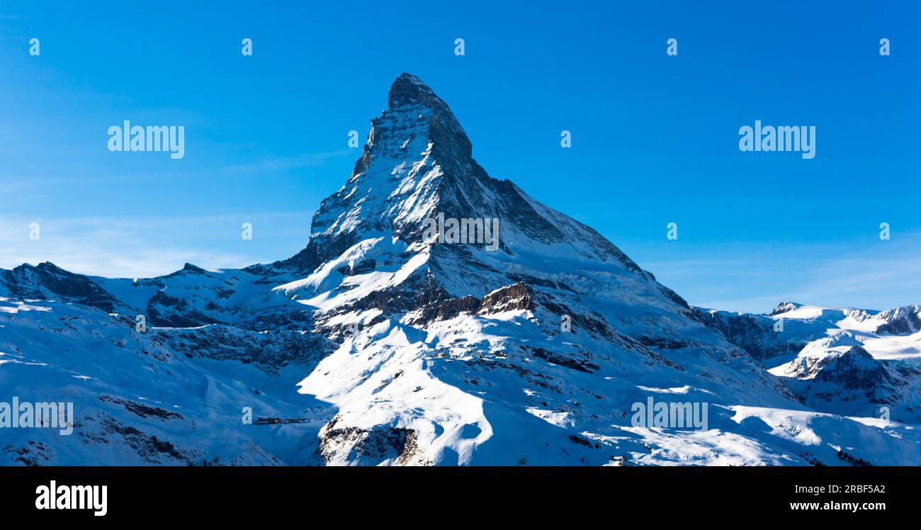 Snowy mountain Matterhorn during the day in winter. Zermatt, swiss alps ...