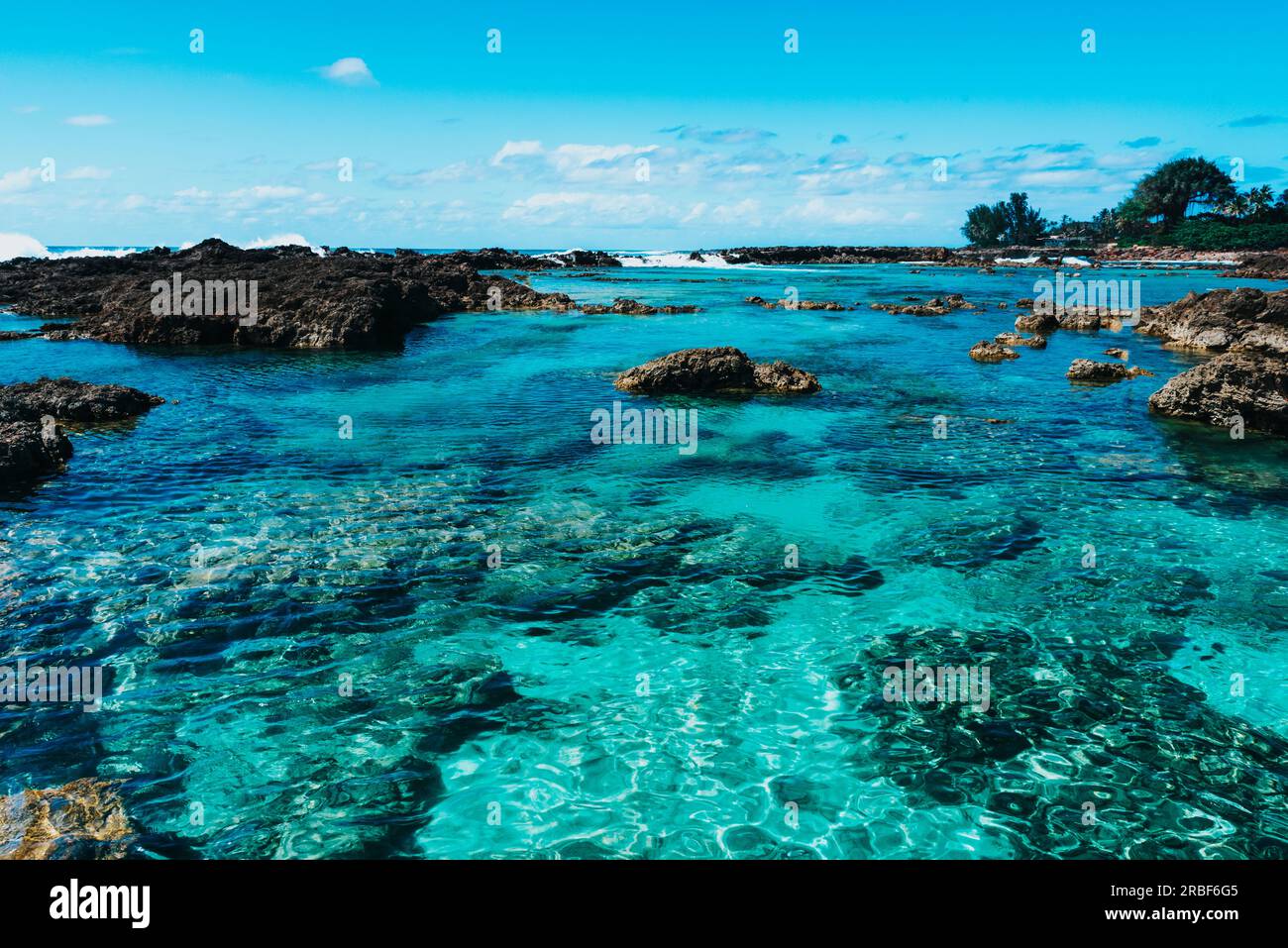 Blue water of a lagoon on Hawaii shore Stock Photo - Alamy