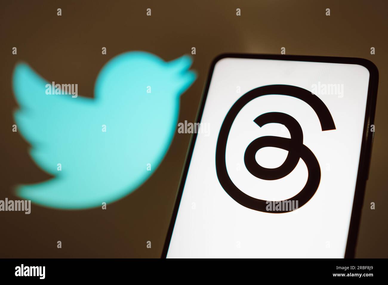 In this photo illustration, the Threads logo is displayed on a ...