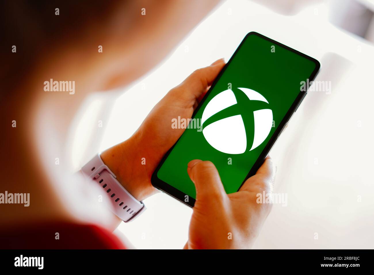 In this photo illustration, the Xbox logo is displayed on a smartphone ...