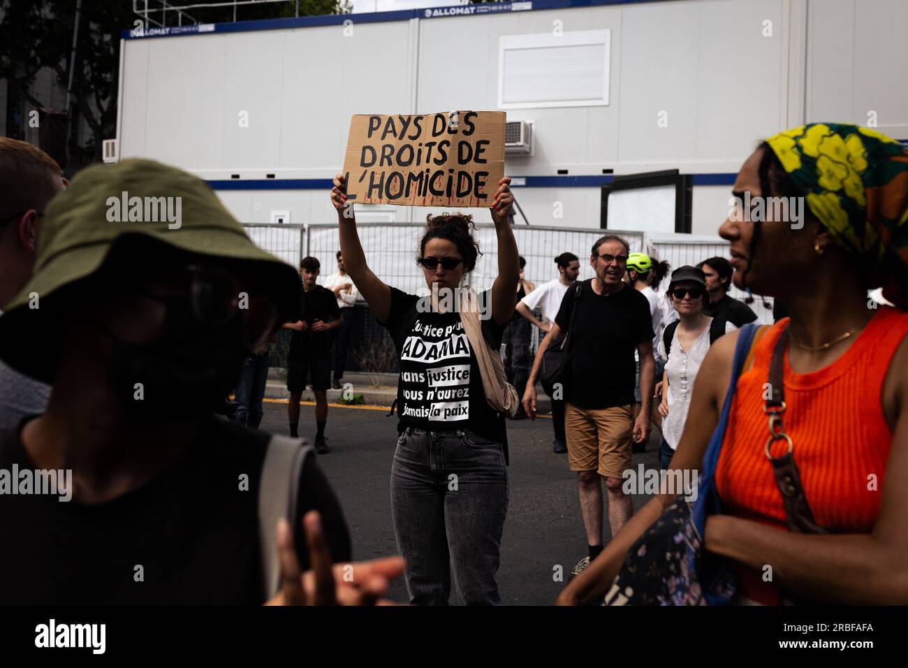 Paris, France. 08th July, 2023. A protester seen holding a placard that ...