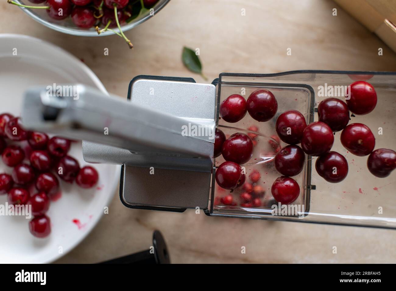 Cherry pitting hi-res stock photography and images - Alamy