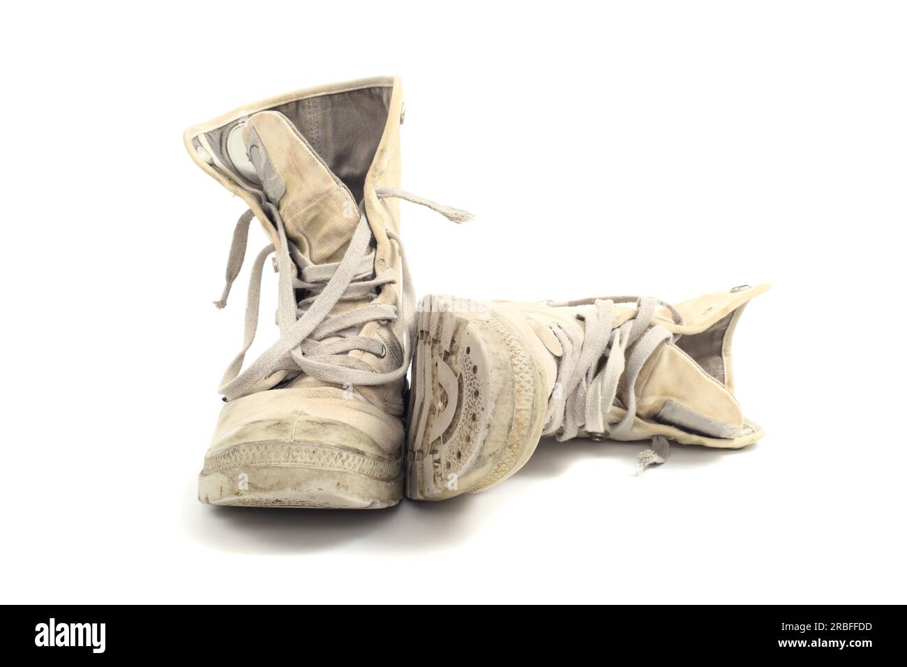 Old canvas boots, isolated over white background Stock Photo - Alamy