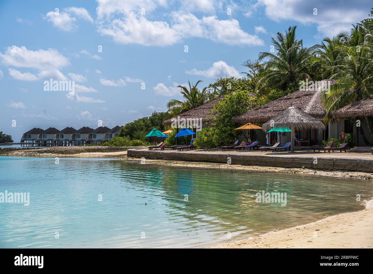 Malé, Maldives -- April 8, 2023. A colorful landscape photo of thatched ...