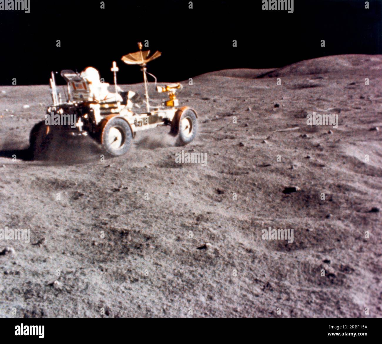 Moon: April 23, 1972 Astronaut John Young gives the Lunar Roving ...