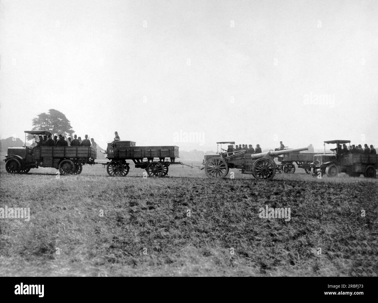 France: August 21, 1914 Motor trucks drawing French artillery guns and ...