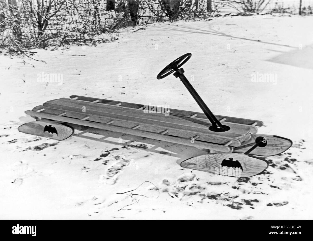 United States: c. 1950 A fancy snow sled, complete with steering wheel ...