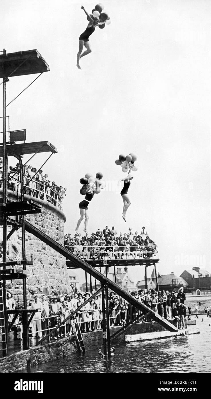 London, England: c. 1929 Three charming mermaids floating gracefully ...