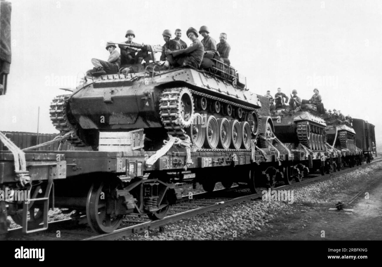 Pusan, Korea: July 27, 1950 Armored equipment is loaded on railroad ...