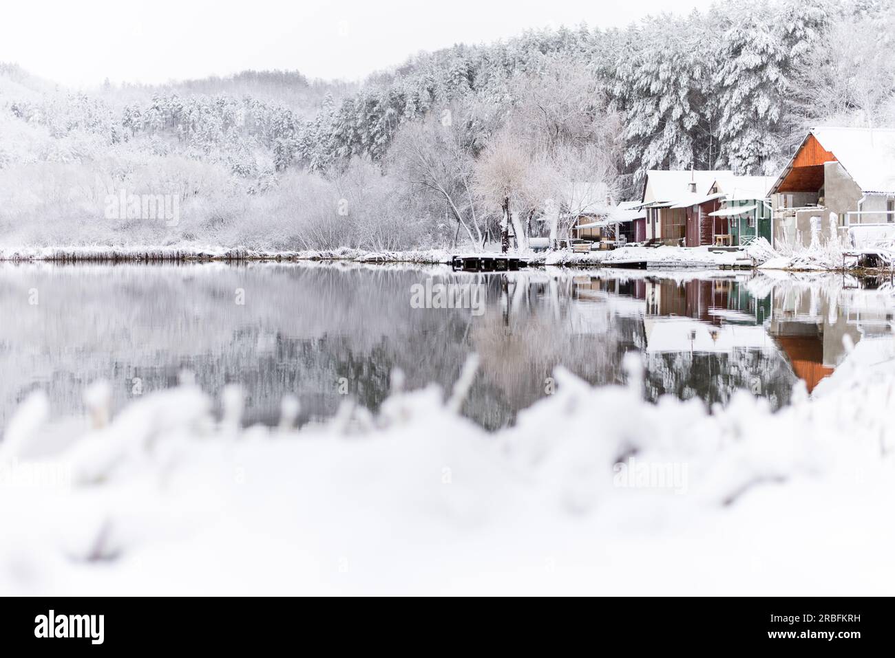 lakeside cottages in snowy winter landscape Stock Photo - Alamy