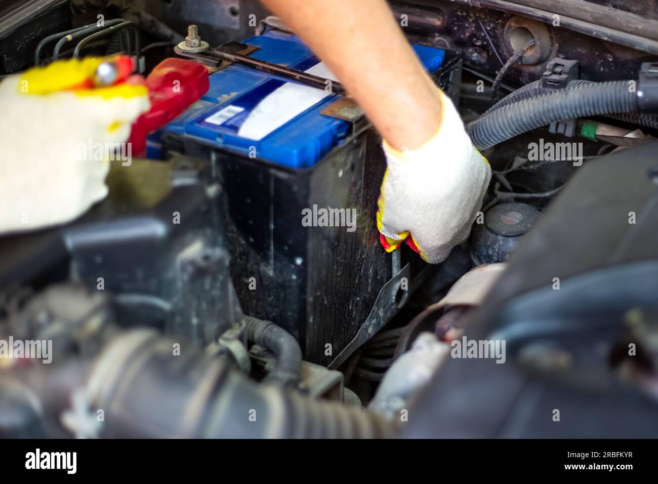 Car battery replacement. auto mechanic screwing the battery mount Stock ...