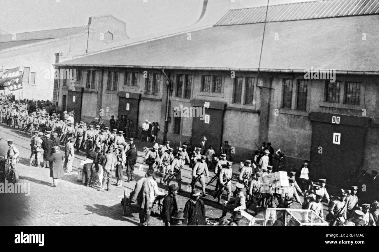 Tsing-Tao, China: c. 1934. Japanese troops debarking at the docks of ...