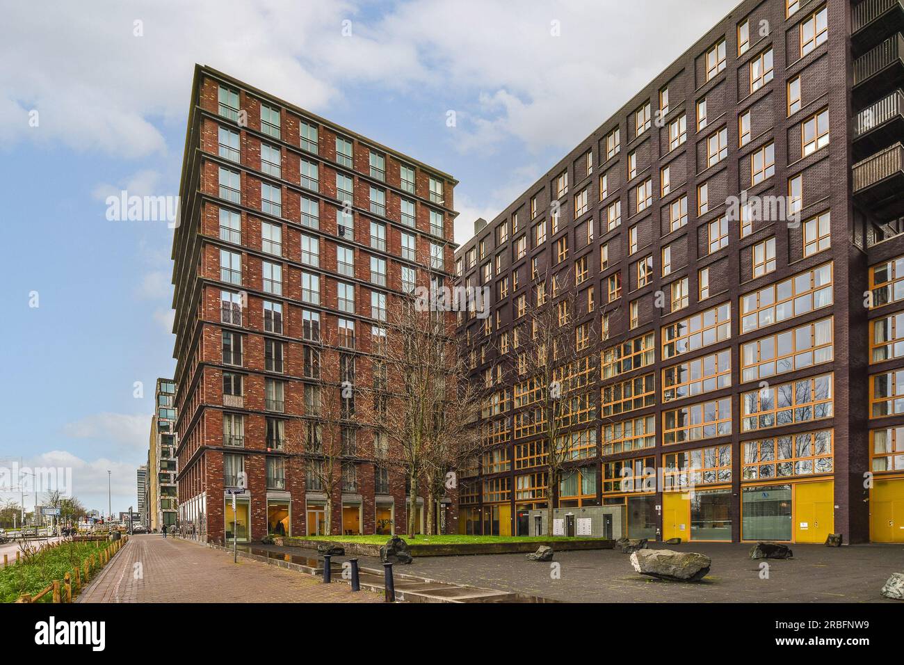 a city street with buildings in the background and people walking on ...