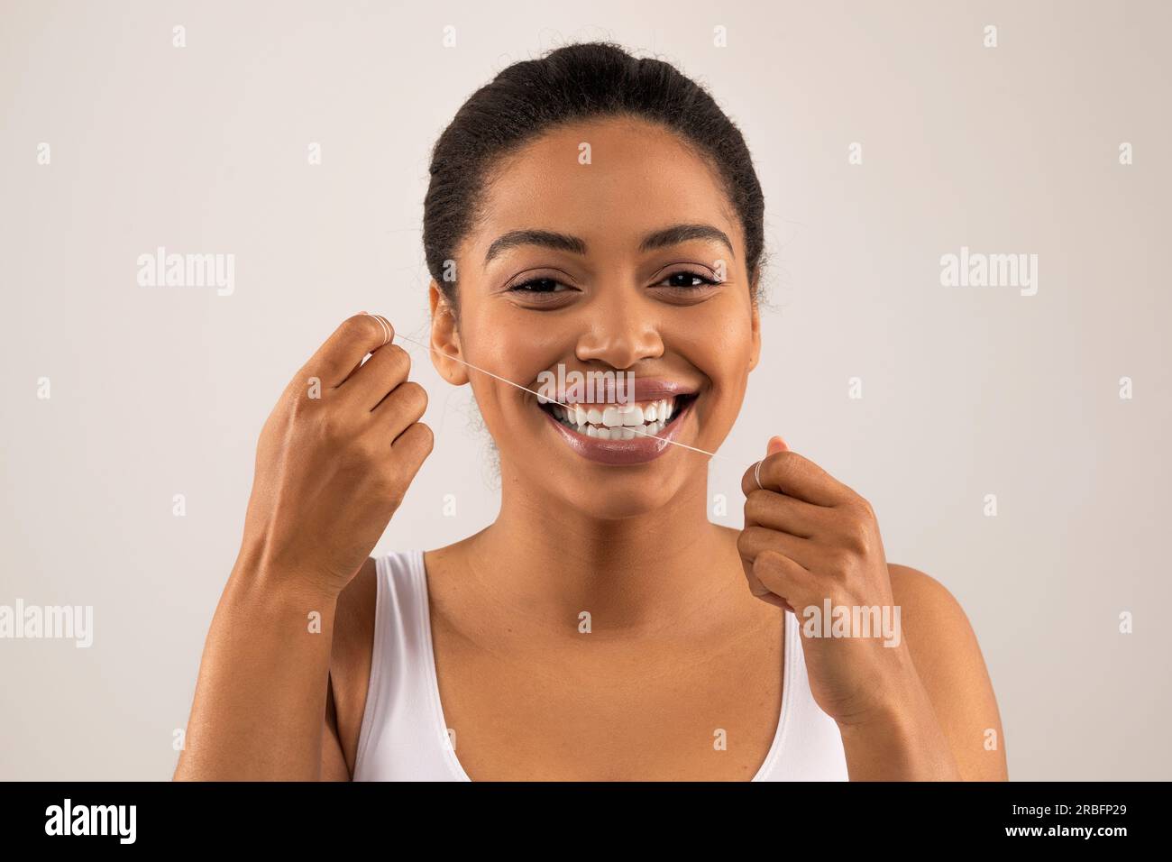 Happy african american woman flossing hi-res stock photography and ...