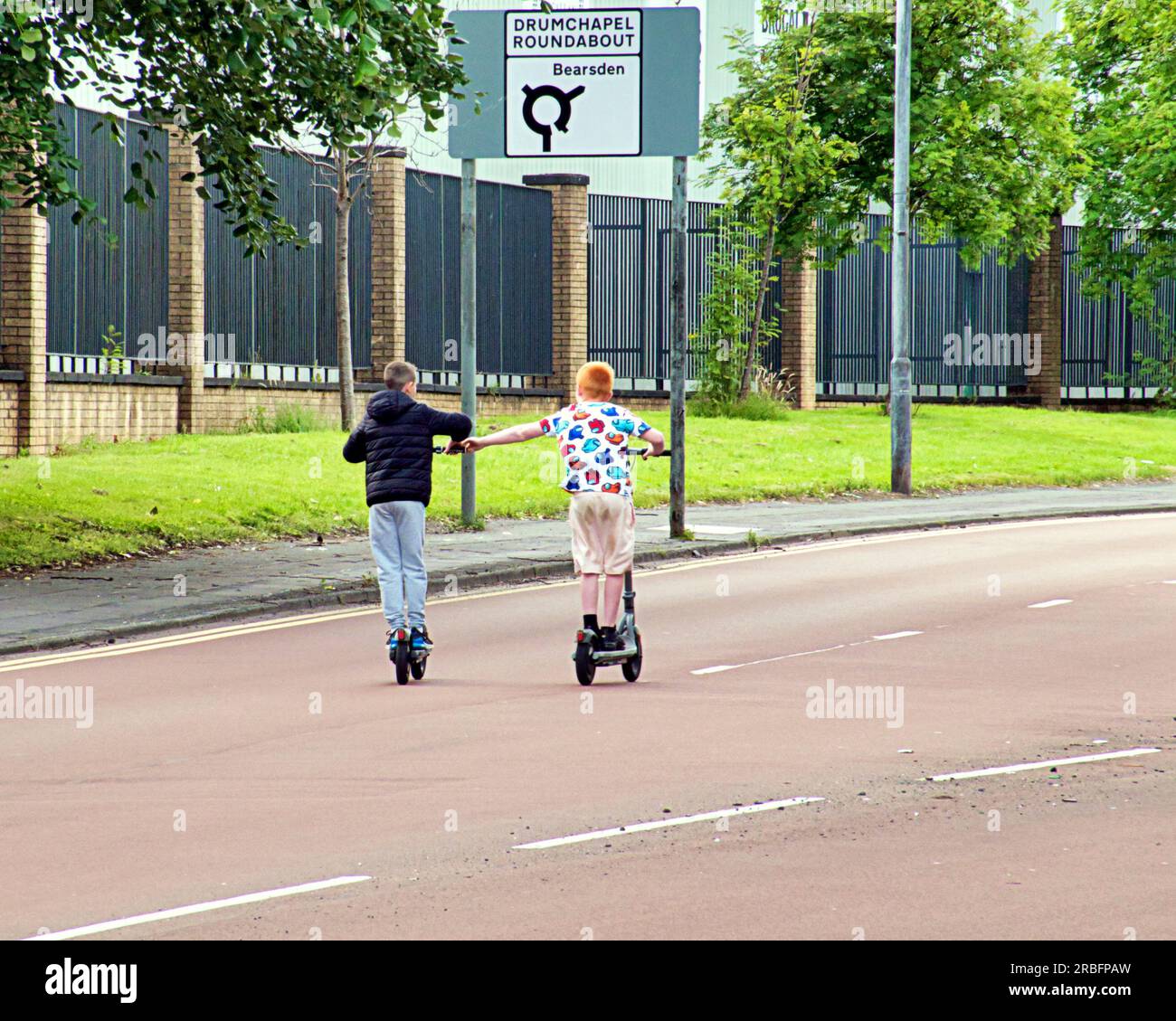 Children on electric scooters hi-res stock photography and images - Alamy
