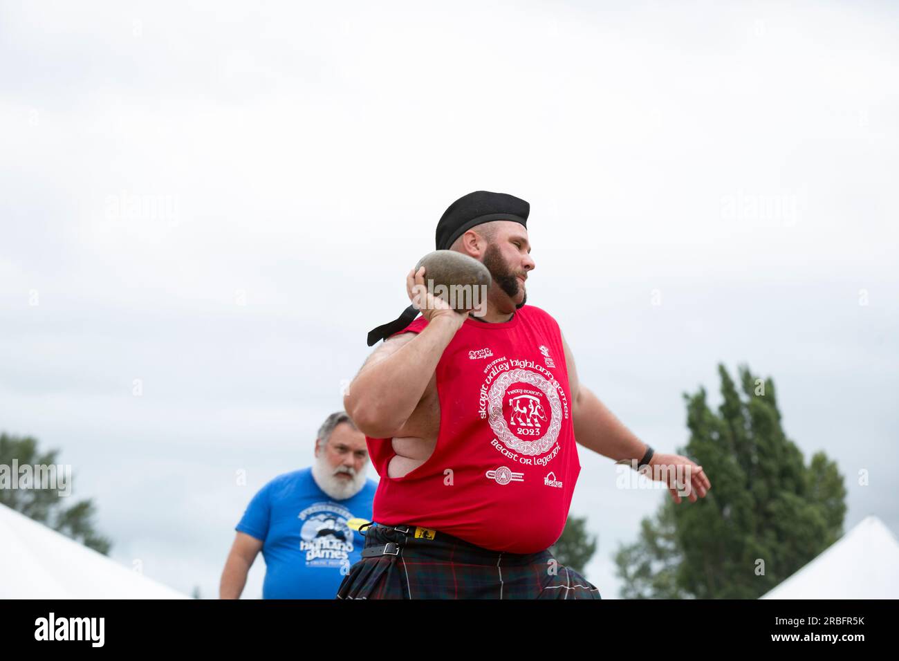 An athlete competes in the stone put event at the Skagit Valley ...