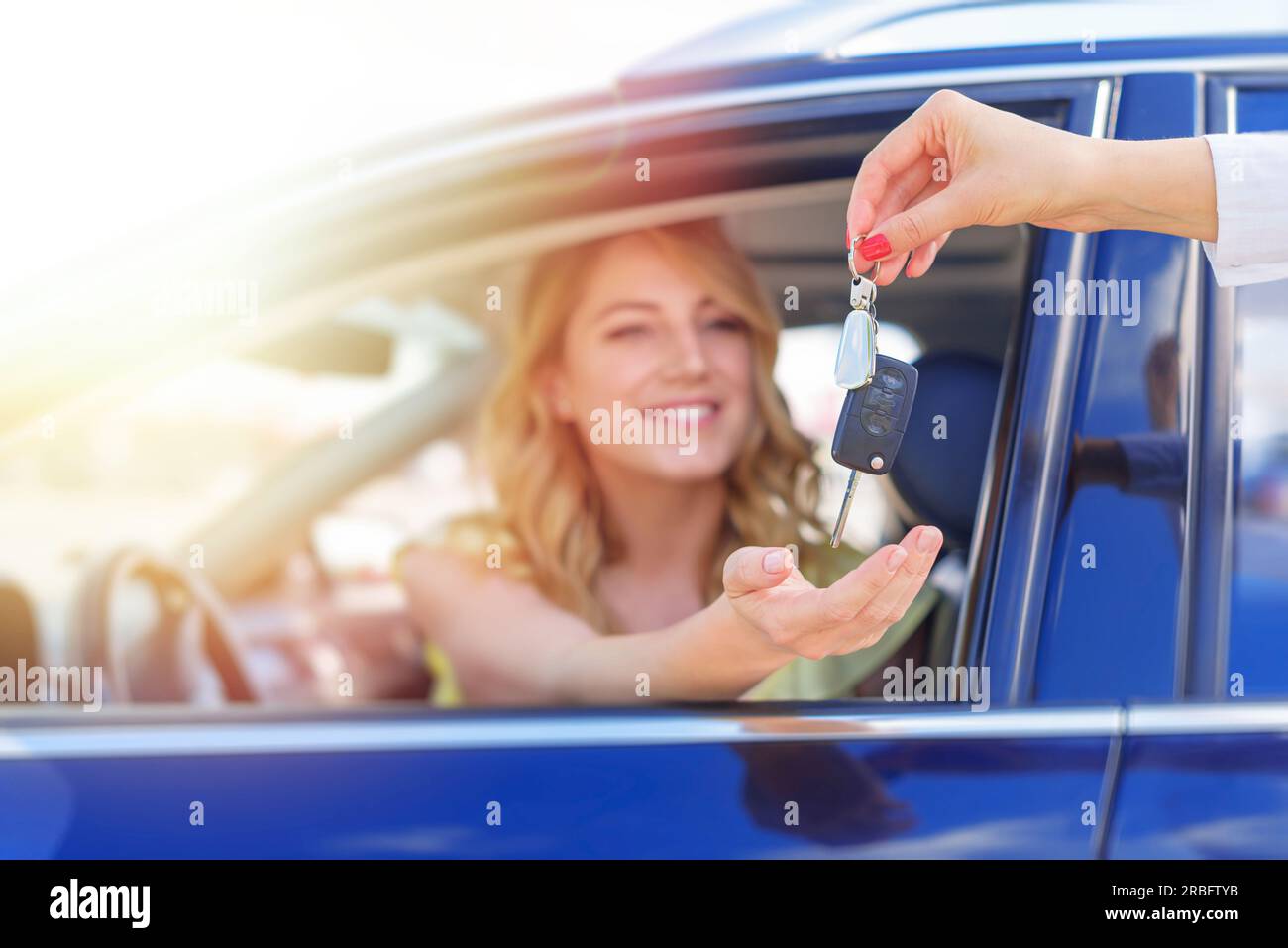 A woman's hand passes the key to the car Stock Photo - Alamy