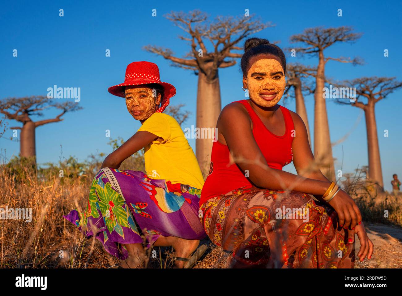 Malagasy Morondava Women In The Baobab Avenue Of Ethnic Sakalava With Facial Mask In Morondava