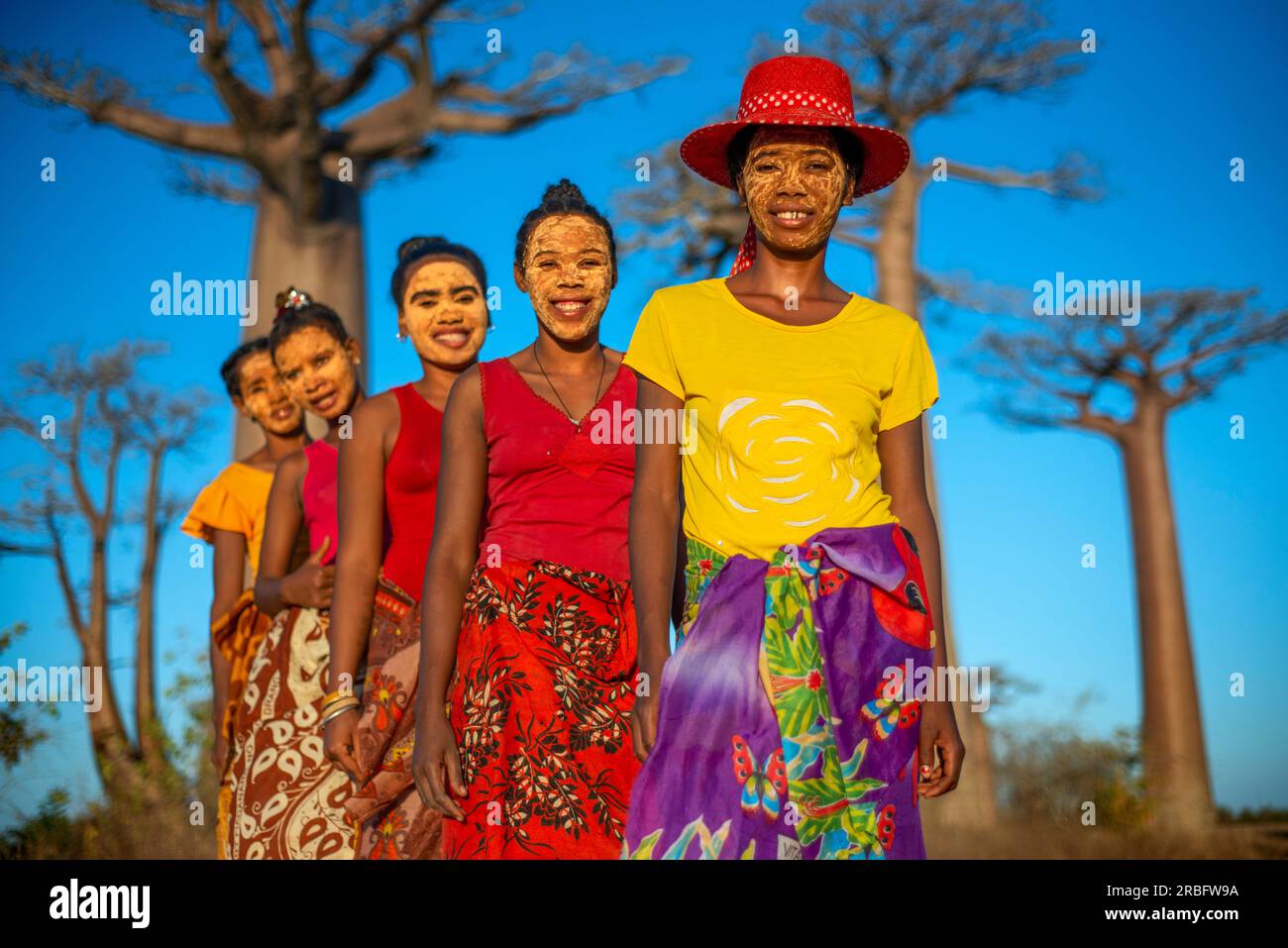 Malagasy morondava women in the baobab avenue of ethnic Sakalava with ...