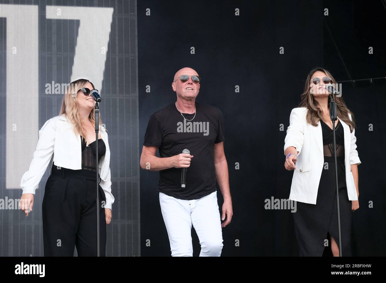 Kelly Barnes, male vocalist Glenn Gregory, and Rachel Meadows with ...