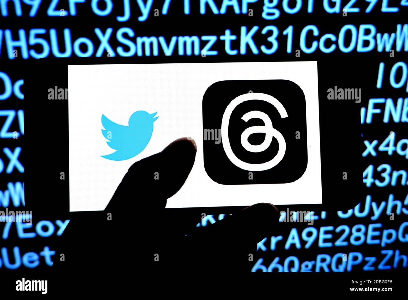 In this photo illustration, a Threads and Twitter logos are seen ...