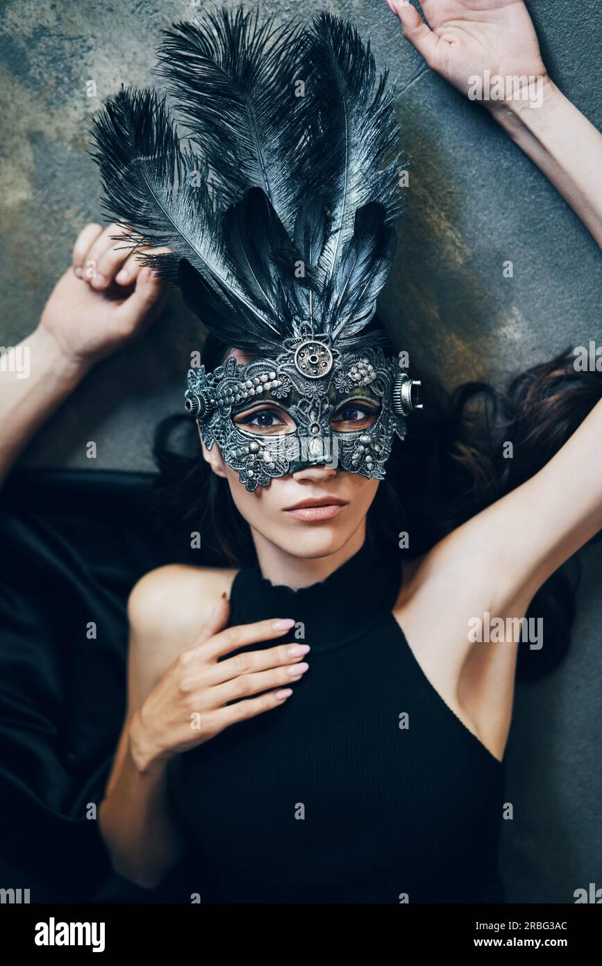 Fashion portrait of young beautiful woman in masquerade carnival mask ...