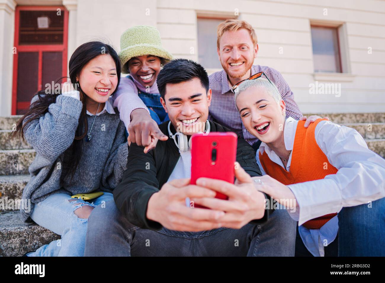 Group of multiracial best firends faving fun using a smartphone. Young ...