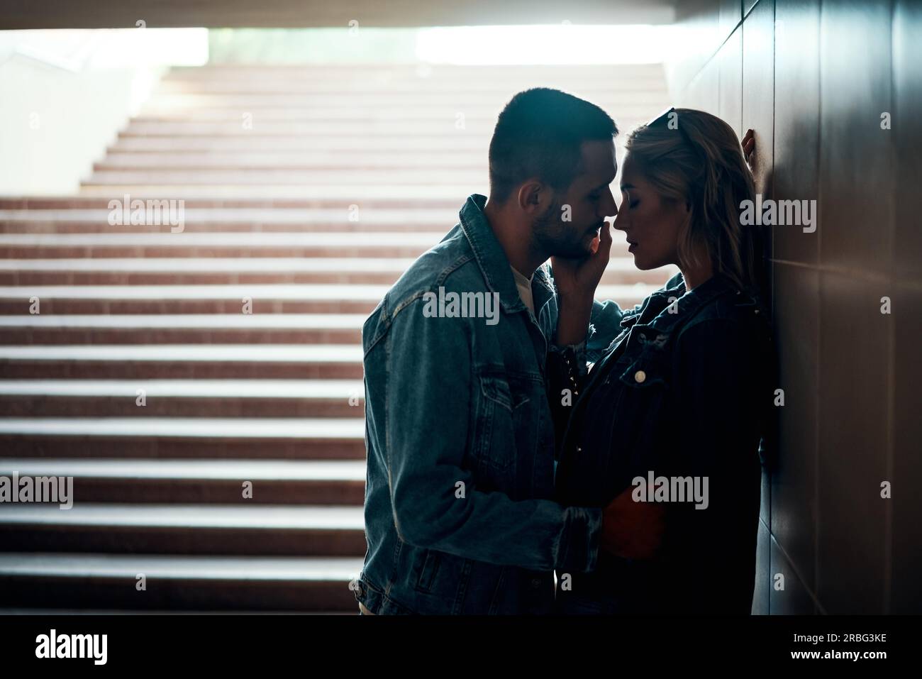 Sensual couple kissing in underground crossing. Love, romantic, passion ...