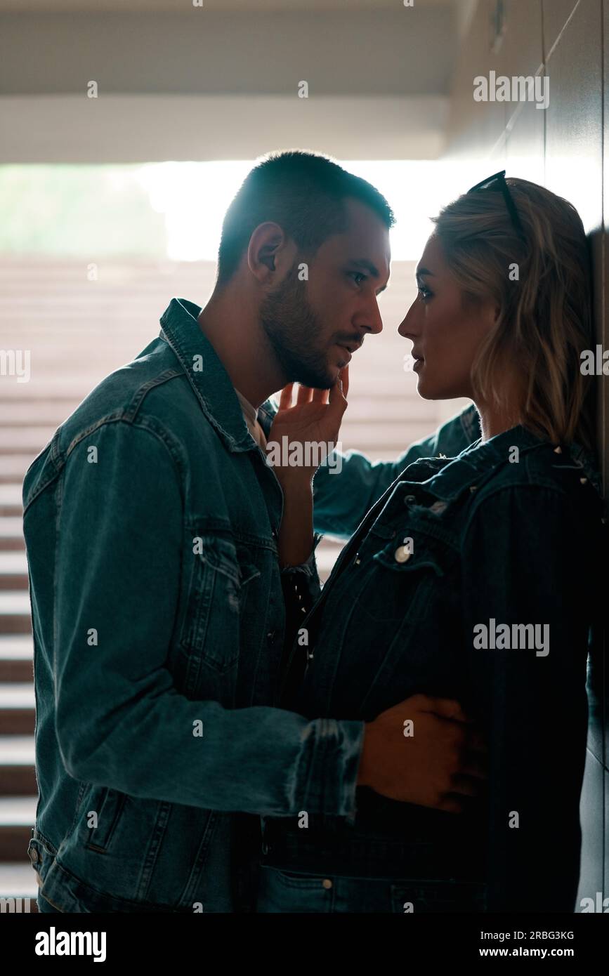 Sensual couple kissing in underground crossing. Love, romantic, passion ...