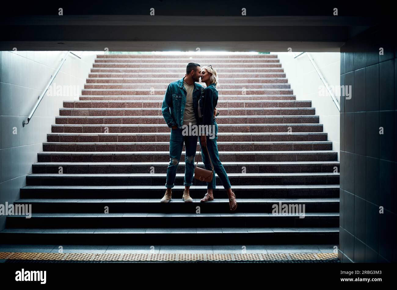 Sensual couple kissing in underground crossing. Love, romantic, passion ...