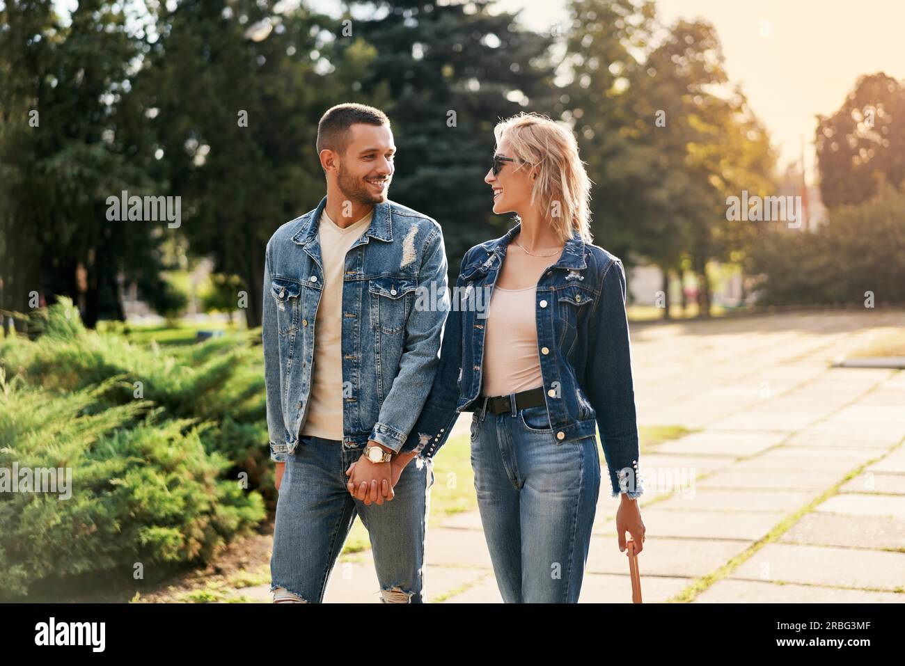 Young couple in love walking outdoors. Relationship, travel concept Stock Photo - Alamy