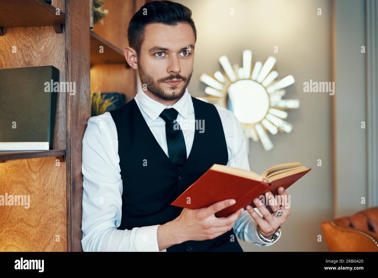 Interior with young man reading hi-res stock photography and images - Alamy