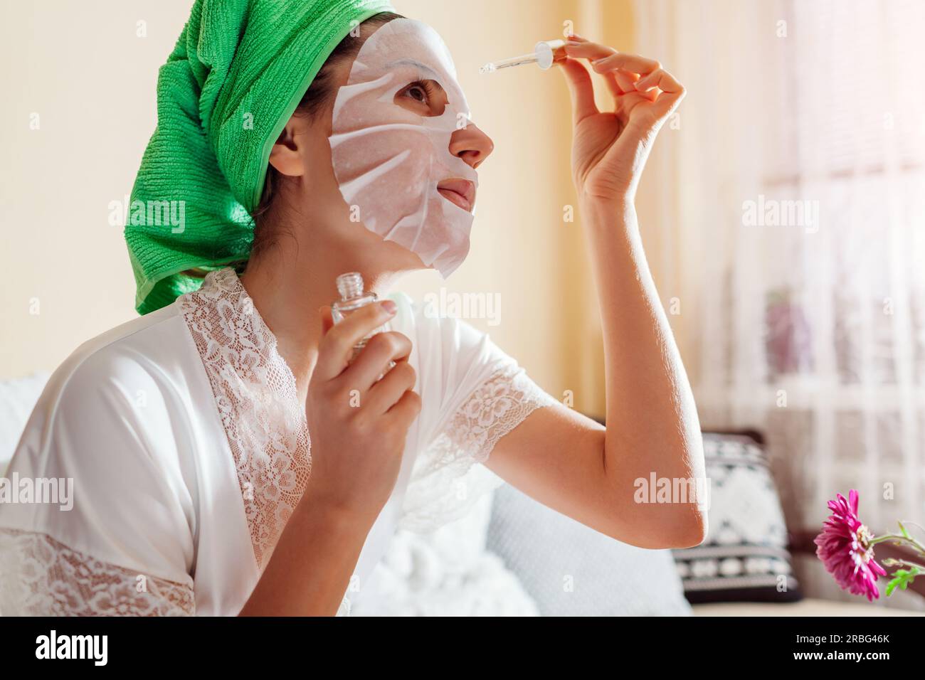 Woman Applying Facial Hyaluronic Acid Serum Wearing Sheet Mask And