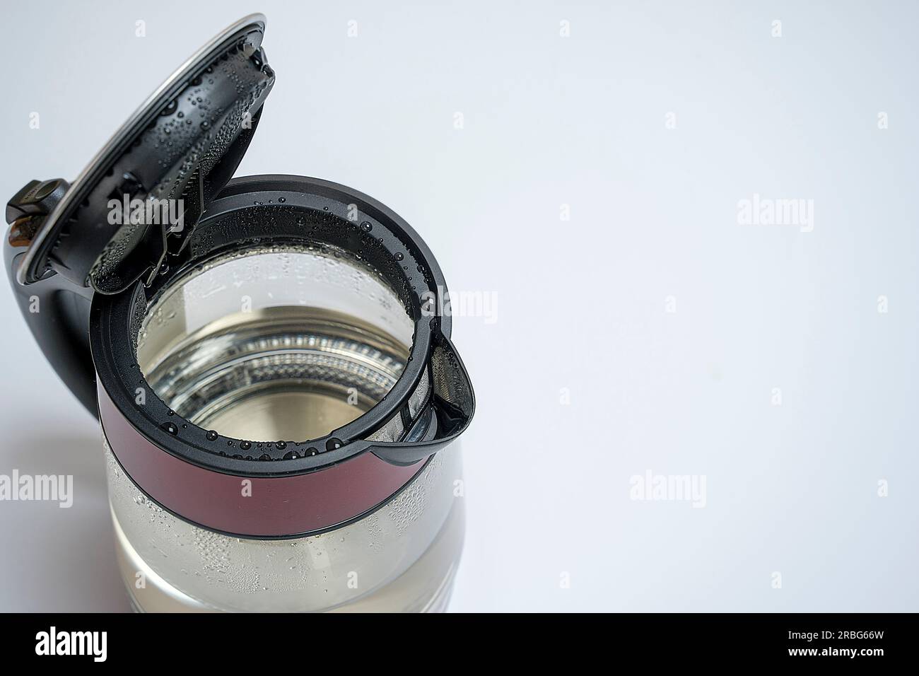 glass electric kettle with an open lid on a white background top view ...