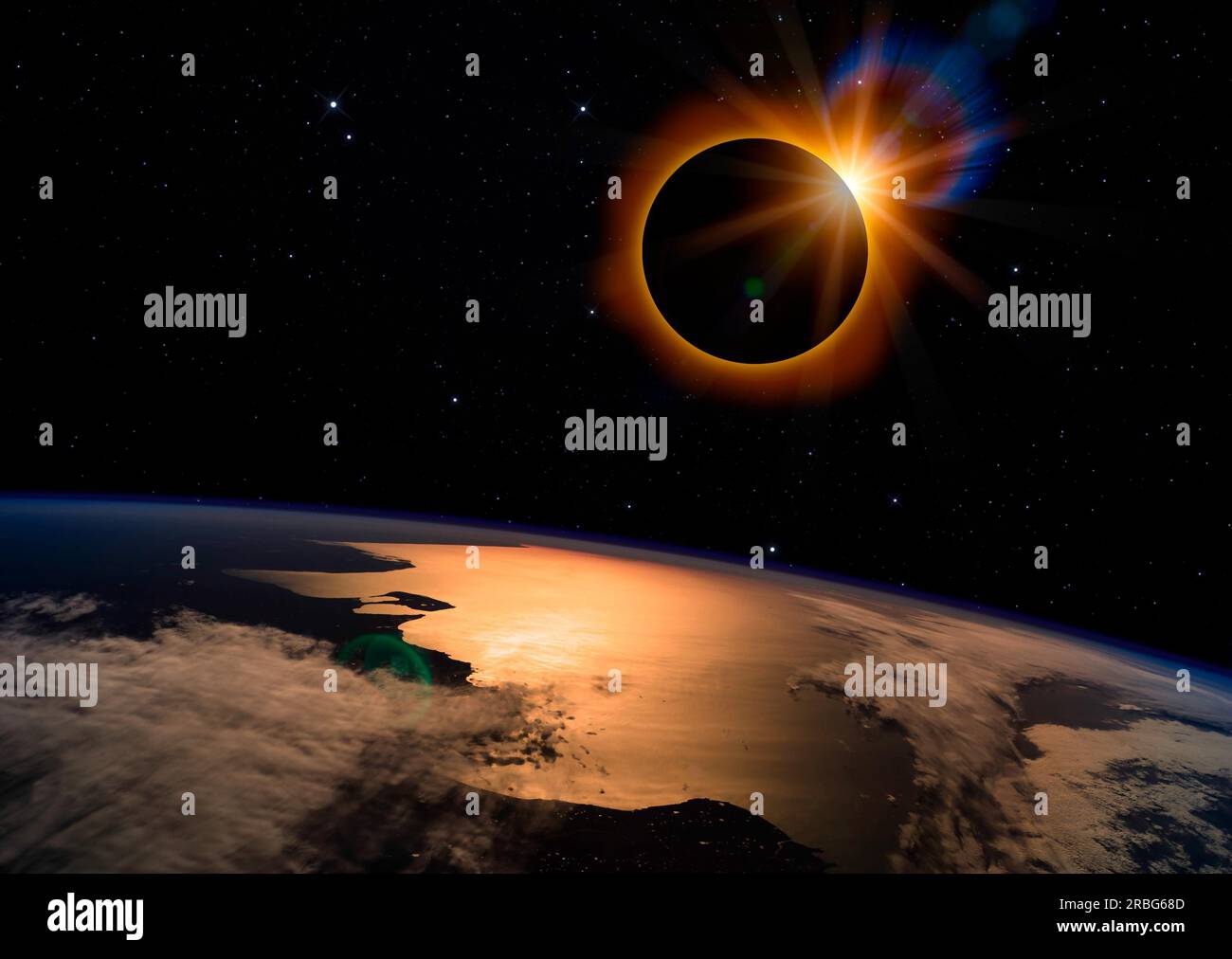 Solar eclipse with orange halo over the planet Earth, on dark starry ...
