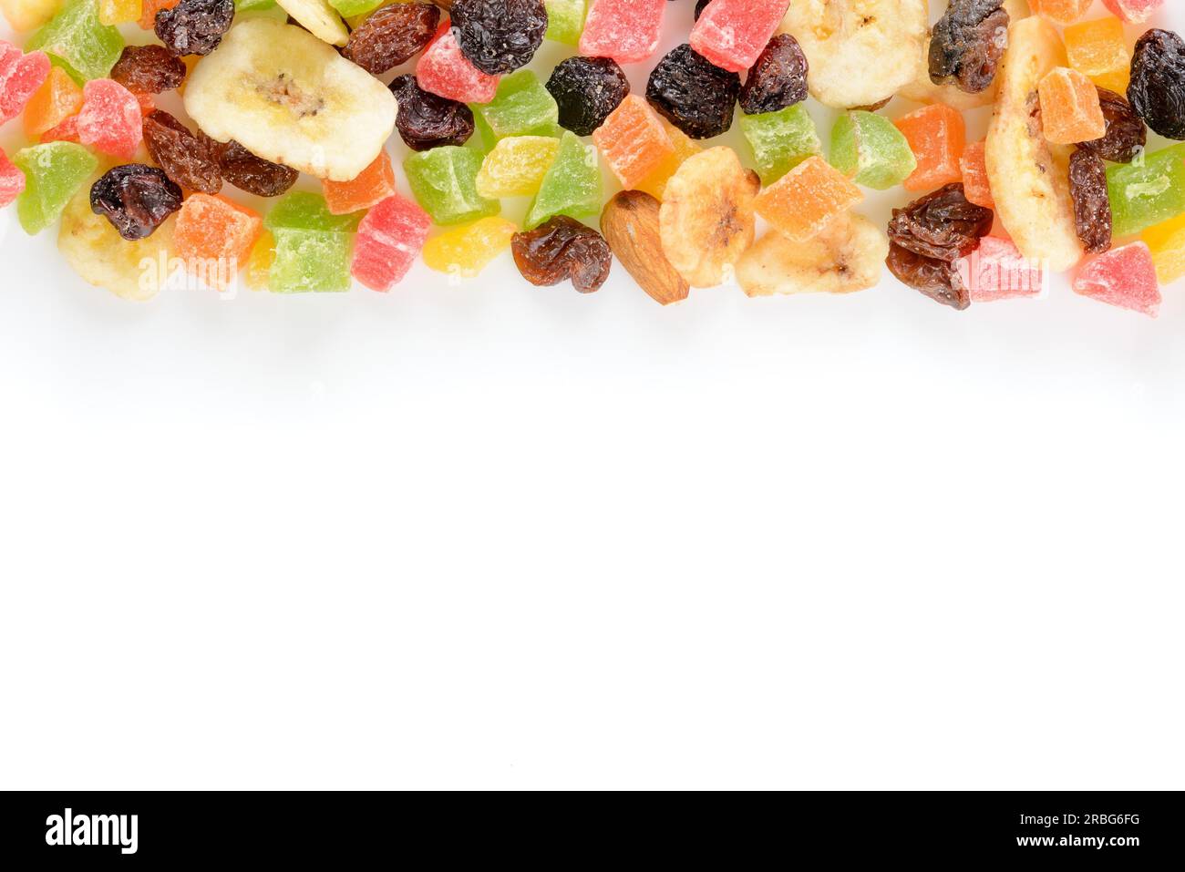 Row of colorful dry fruits isolated on white background. To be used as ...
