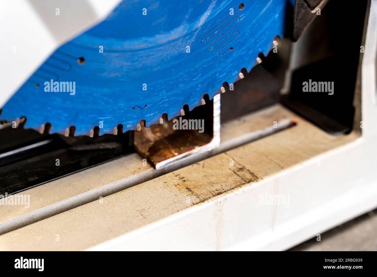 metal saw with tool cutting disc makes a cut. work in home workshop ...